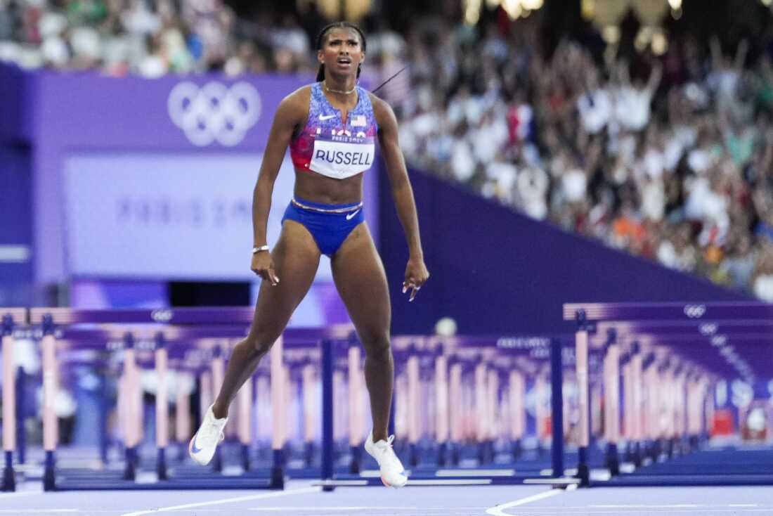 American Masai Russell wins gold in 100 meter hurdle by a hundredth of ...