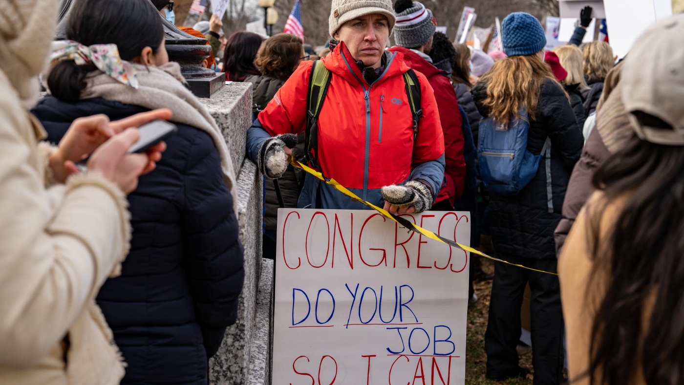 Protesters rally against Trump putting USAID workers on leave : NPR