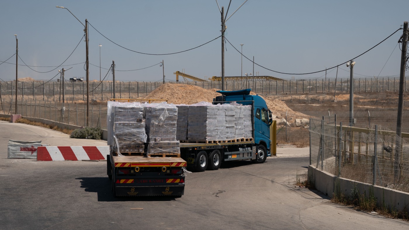Food aid piles up in Gaza. Here's why it's not reaching those in need : NPR