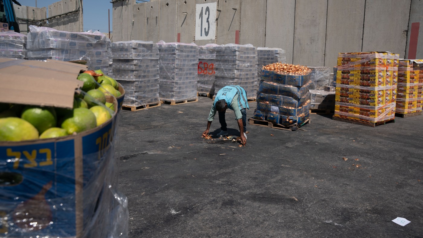 Food aid piles up in Gaza. Here's why it's not reaching those in need : NPR