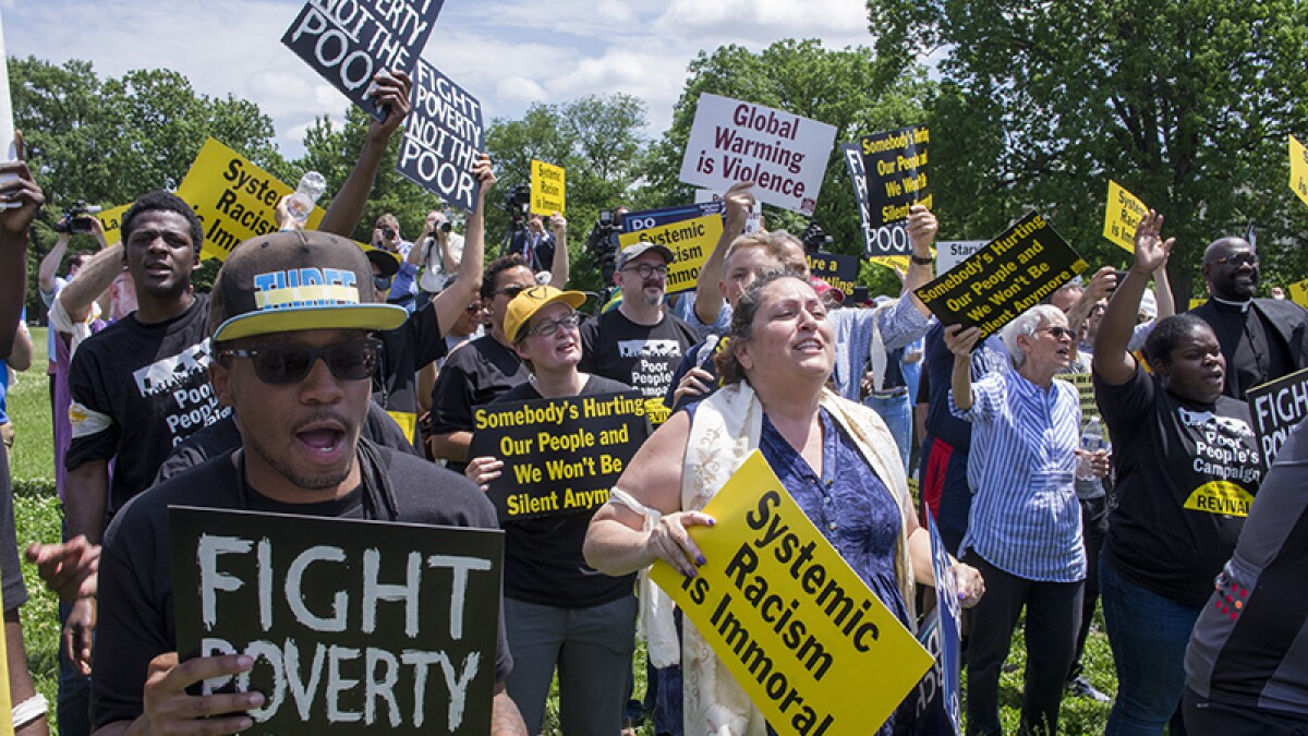 poverty protest signs
