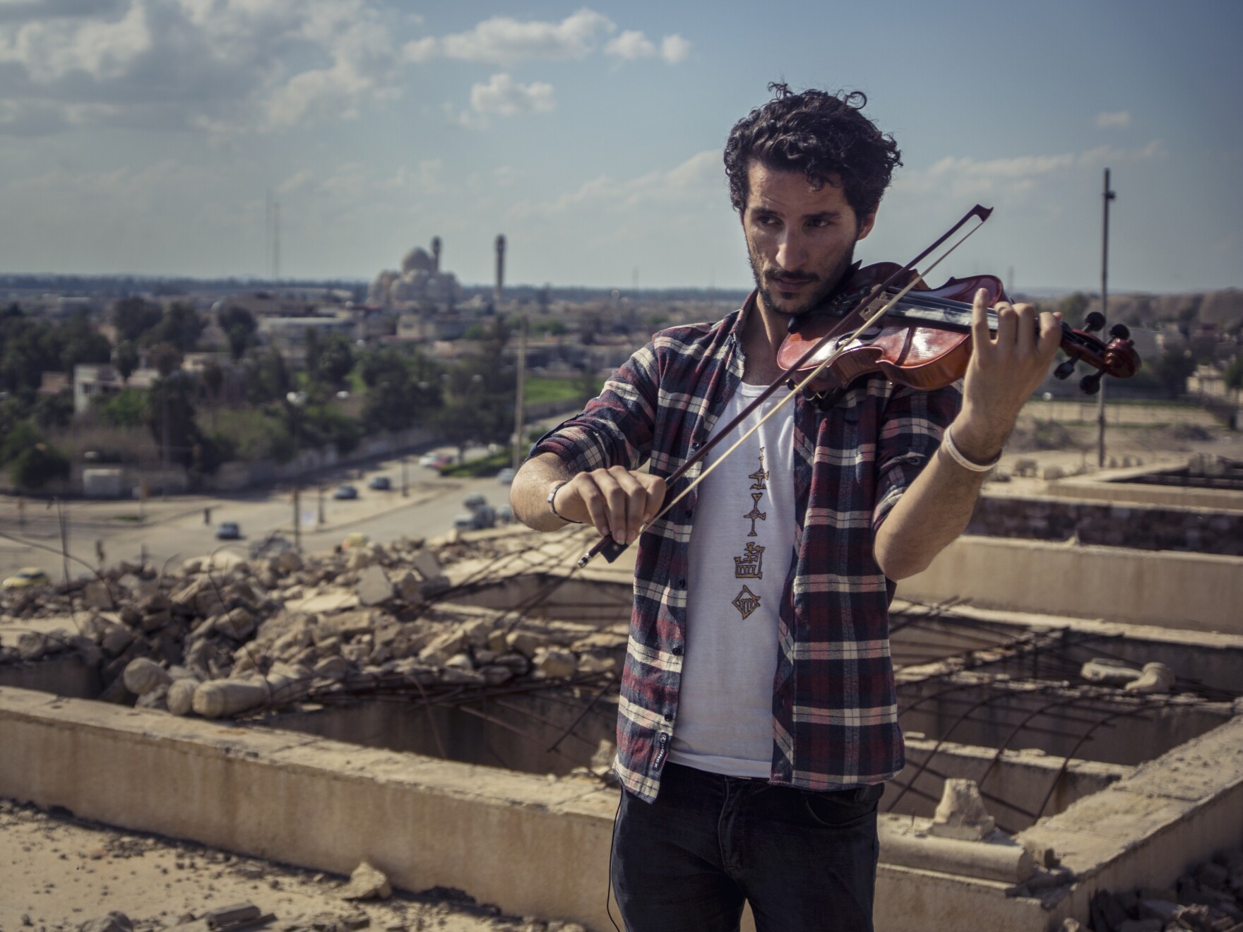 ISIS destroyed his instruments. He made a new one from scraps and composed an album